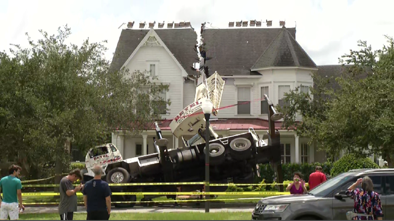 Crane collapses, splits home in half Crane collapses, splits home in half